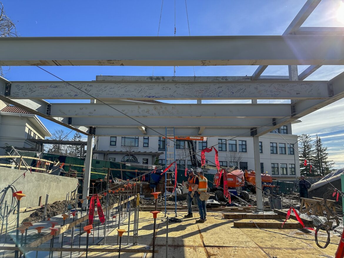 More photos | City adds signatures to beam marking pool milestone ...