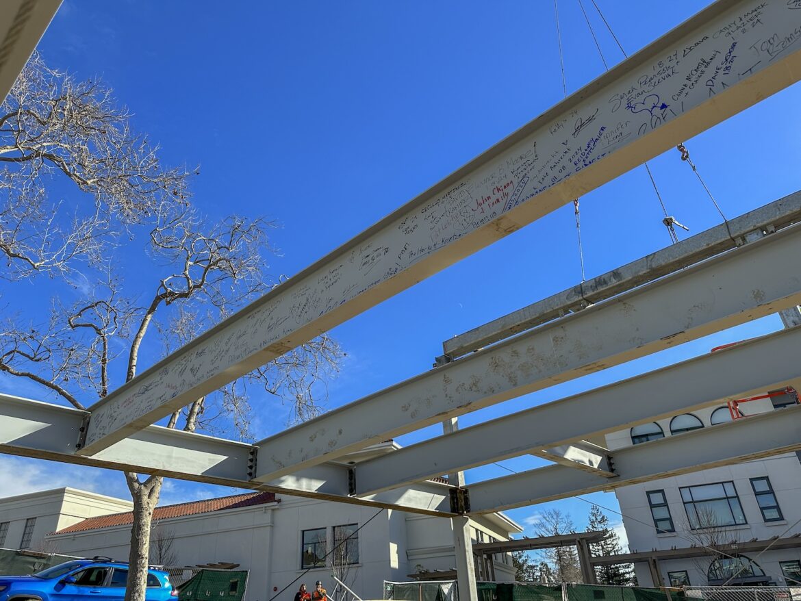More photos | City adds signatures to beam marking pool milestone ...