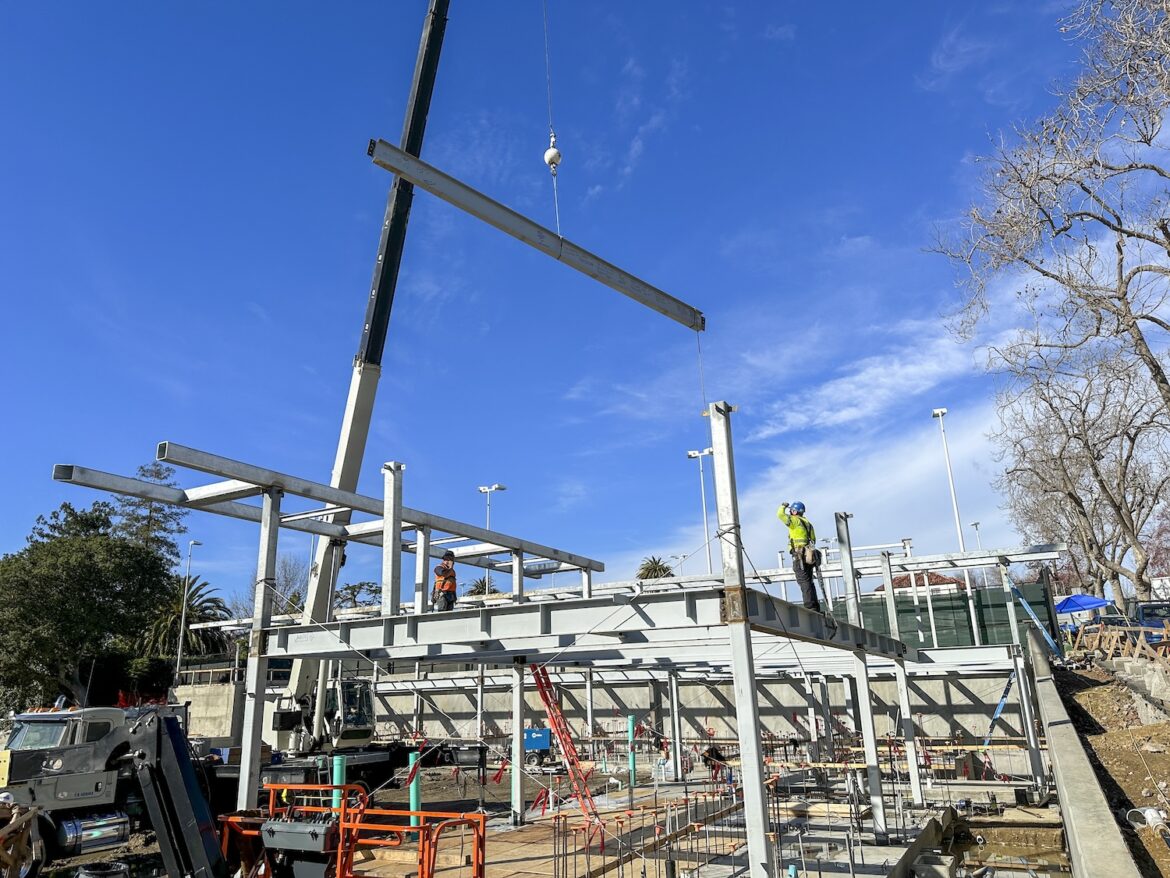 More photos | City adds signatures to beam marking pool milestone ...