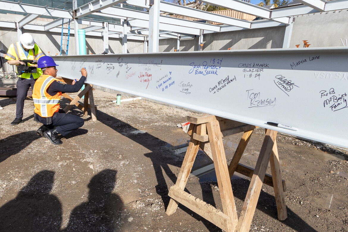 More photos | City adds signatures to beam marking pool milestone ...
